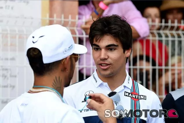 Lewis Hamilton en Lance Stroll yn Monako