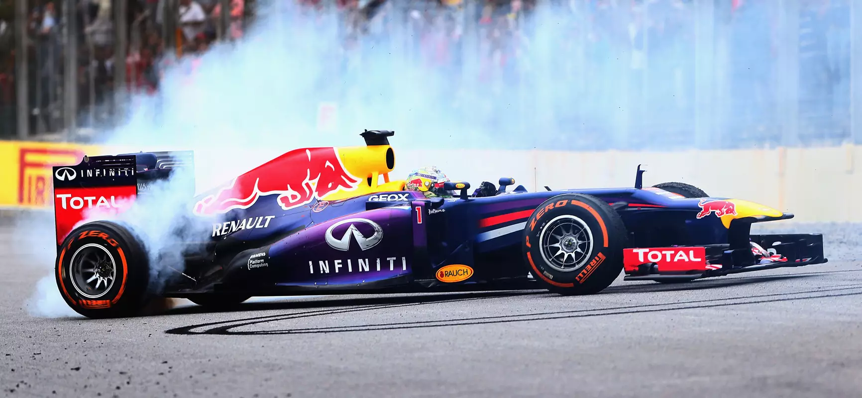 Sebastian Vettel celebrates the end of 2013 and his fourth world championship with donuts