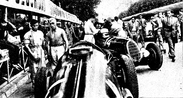 nuvolari_and_box_scuderia_ferrari_alfa_romeo.jpg