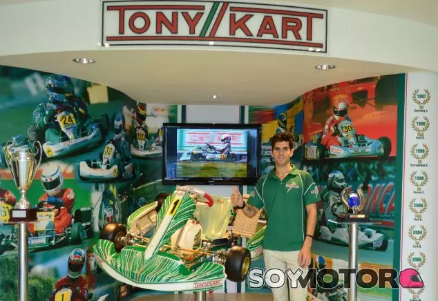 Jaime Alguersuari next to a kart from the Tony Kart team