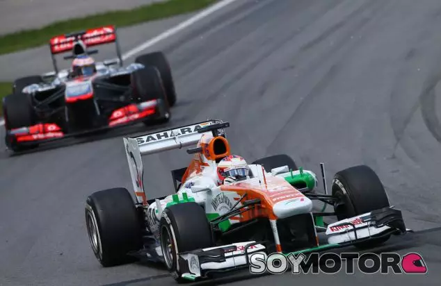 Jenson Button à la poursuite de Force India de Paul di Resta